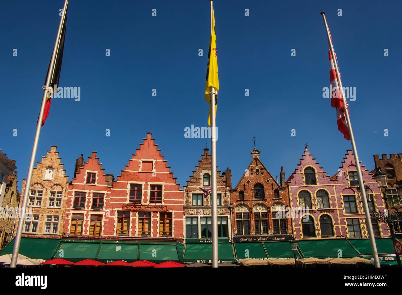 Colourful, traditional Belgian townhouses, buildings and flags in the ...