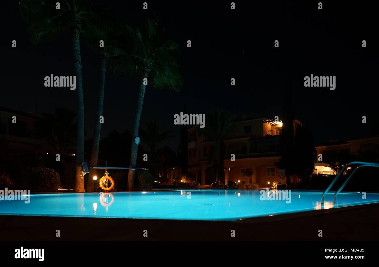 Modern backyard water pool at night Stock Photo - Alamy