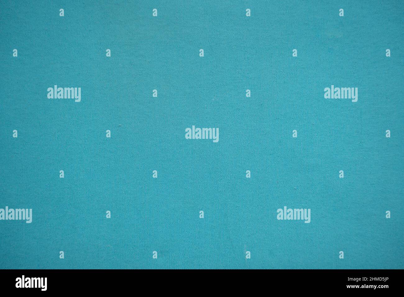 a bright turquoise blue textured woven fabric background Stock Photo ...