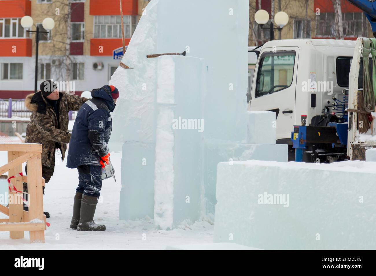 Installer in winter gear at the installation of ice panels Stock Photo ...