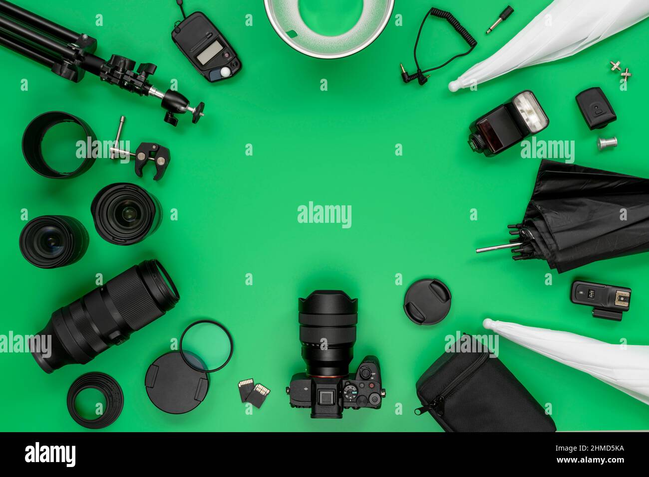 Green background table with some photography props Stock Photo - Alamy