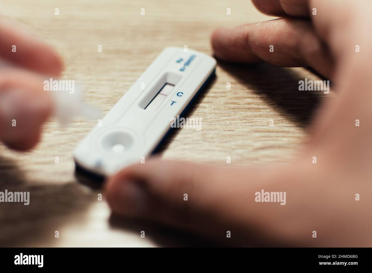 The man does the covid-19 antigen rapid pcr test. The test returned a ...