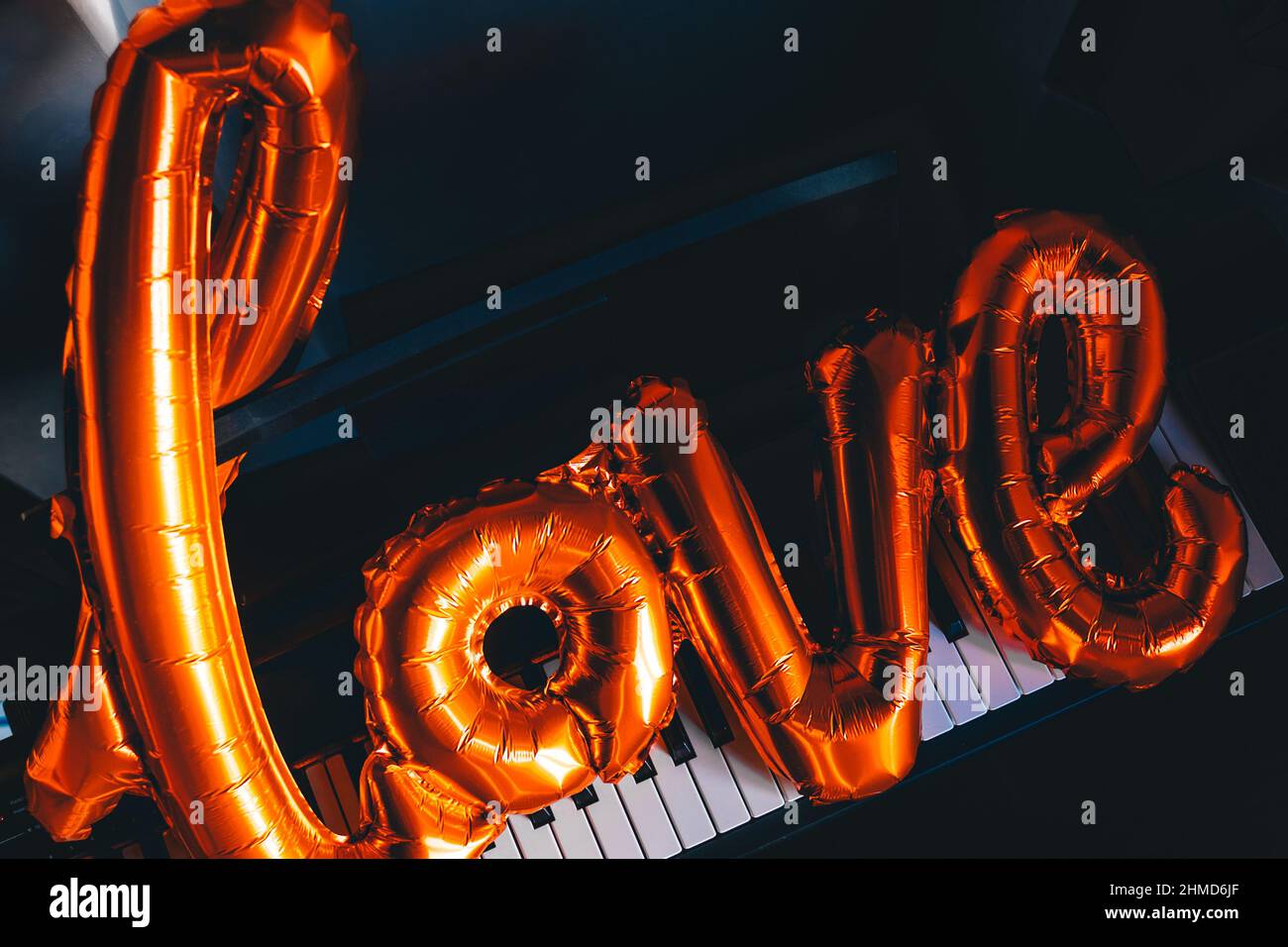 balloon in shape of word love on piano keys. copy space. Greeting card ...