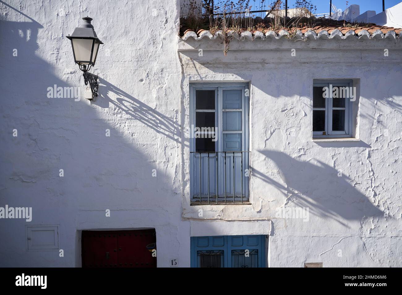 Spanish wall with shadow Stock Photo - Alamy