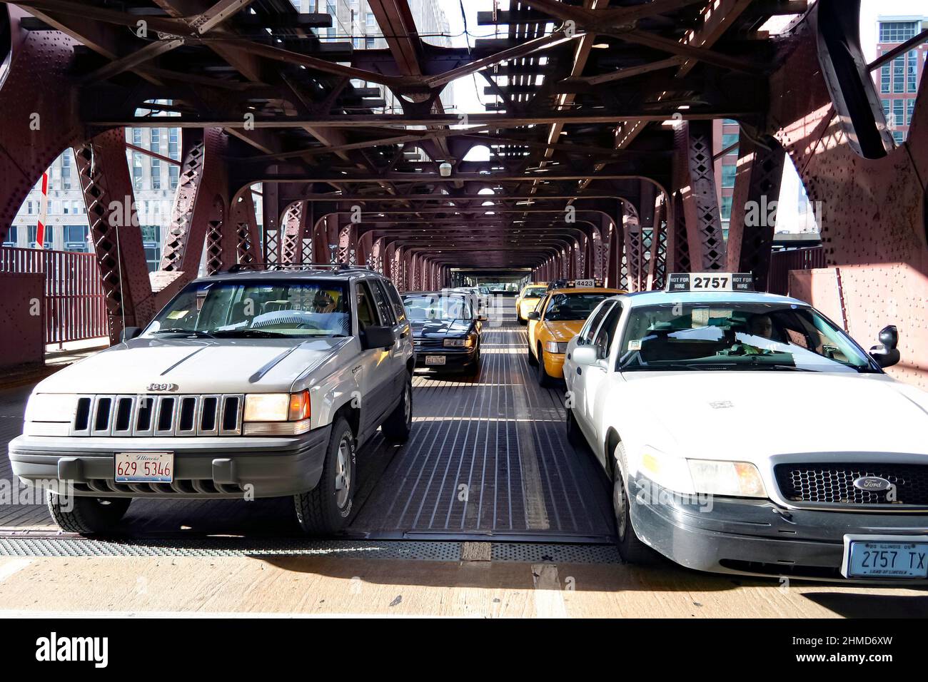 Cars at a stop light at the end of Lake Street Bridge, over the Chicago ...
