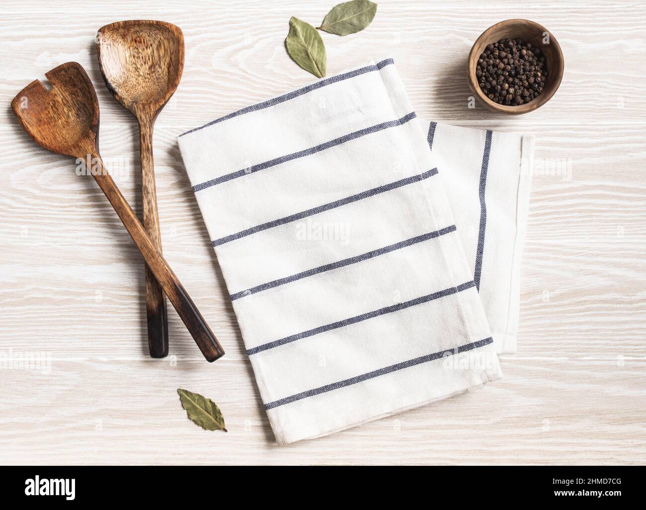 Minimal white kitchen background with cotton napkin, various spices and ...