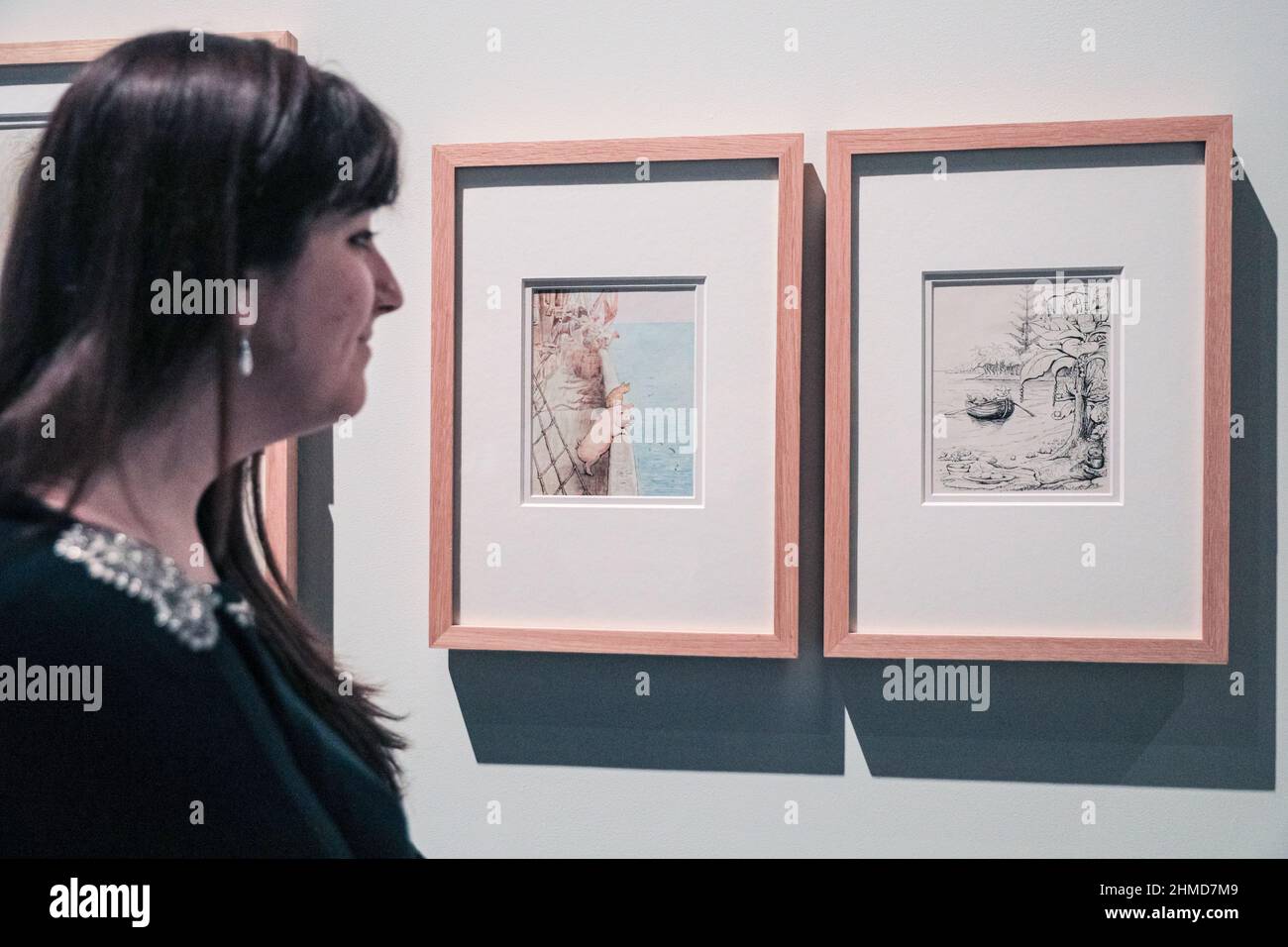 London, UK. 09th Feb, 2022. A staff member looks at artwork from 'The ...