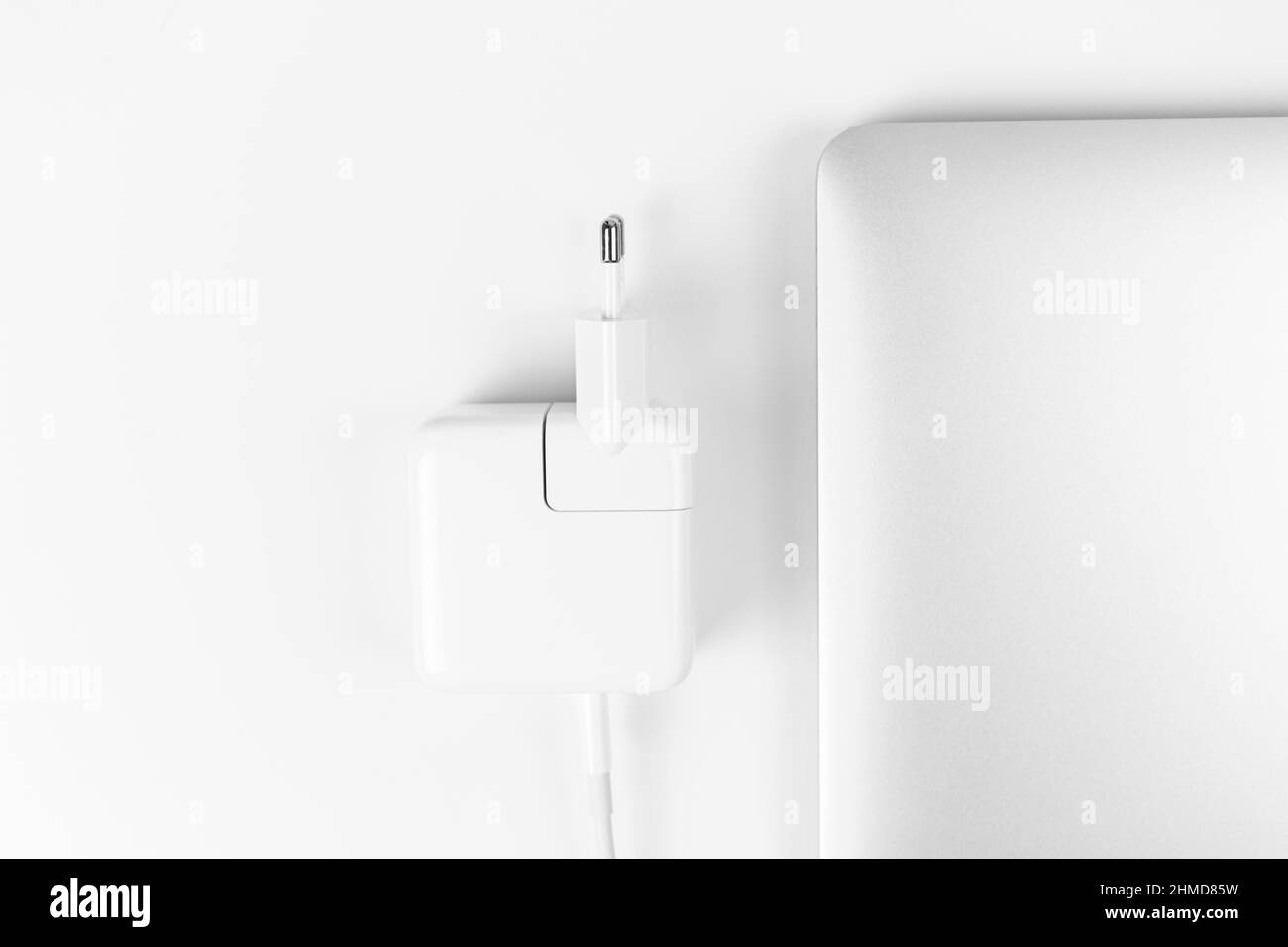 Charging battery laptop. Modern and fast USB C charger with silver ...