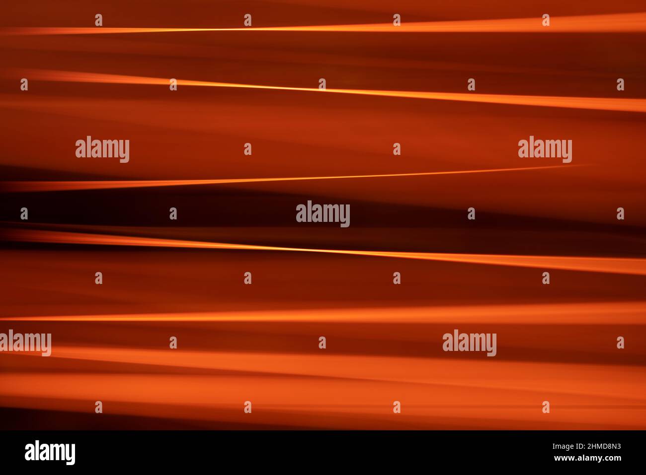 Bright dark red-orange background in fiery and fiery stripes with an ...