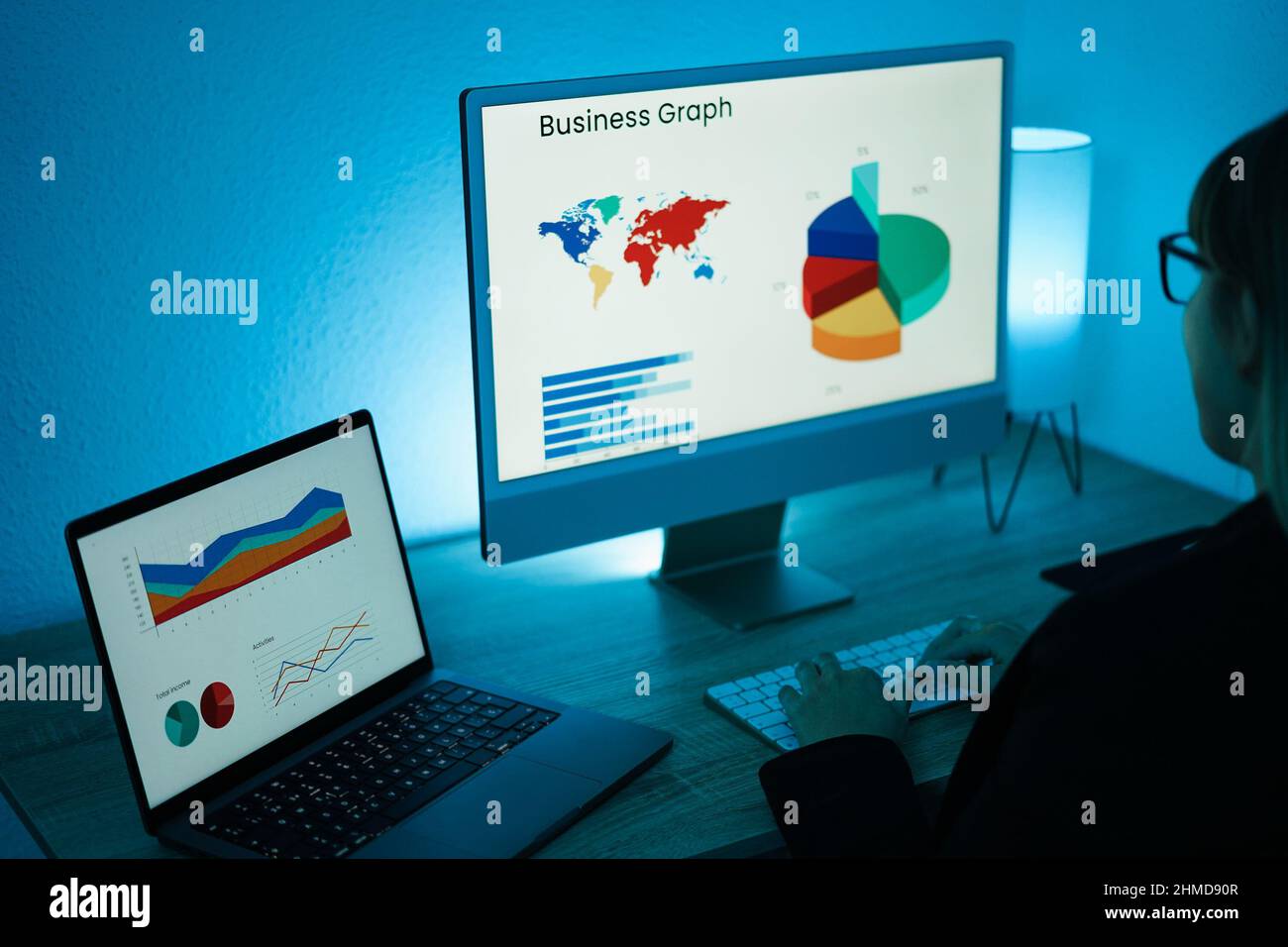 Young woman studying data charts for marketing financial reports ...