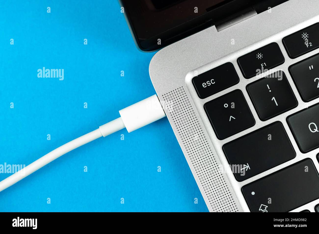 Charging laptop with modern USB Type C port. Laptop low battery concept ...