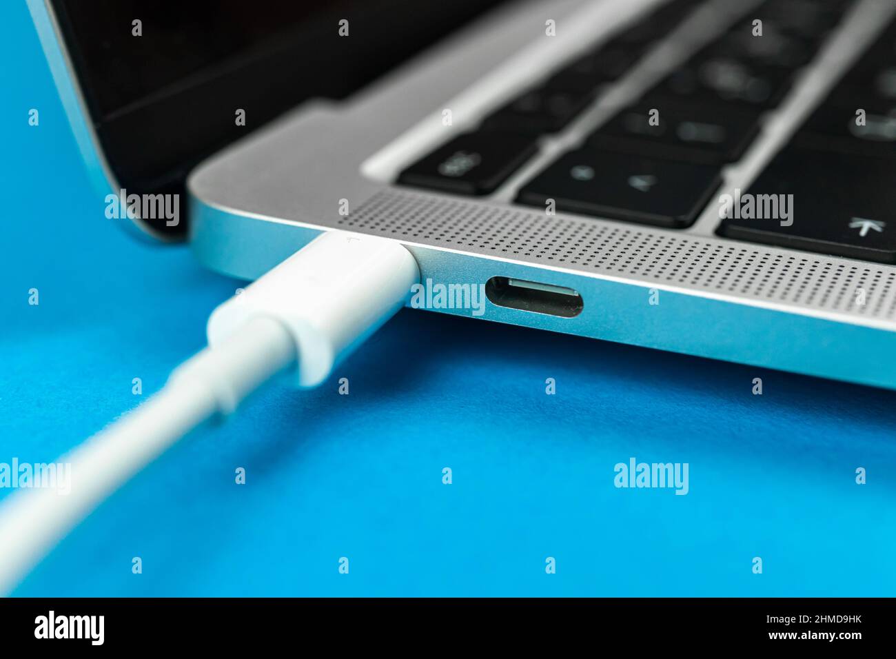 Charging laptop with modern USB Type C port. Laptop low battery concept ...