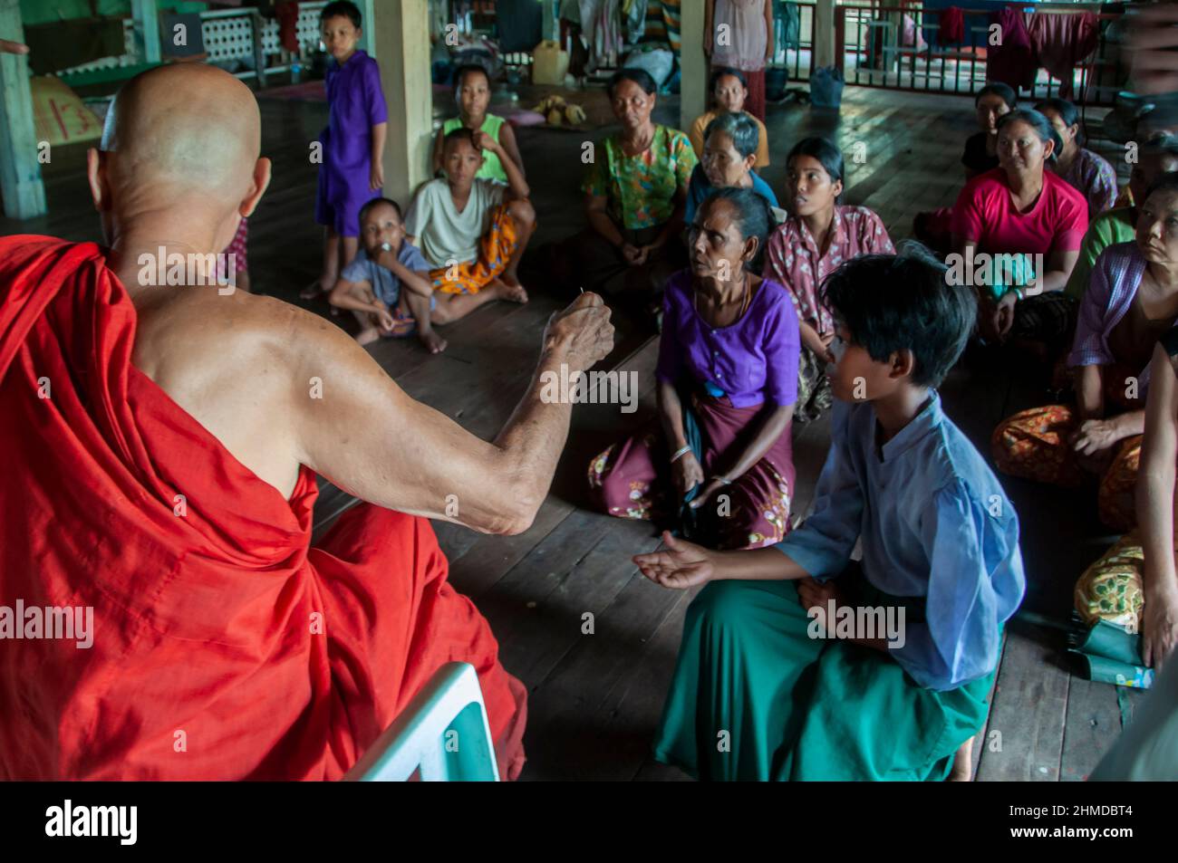 Buddhist monk giving money cyclone hi-res stock photography and images ...