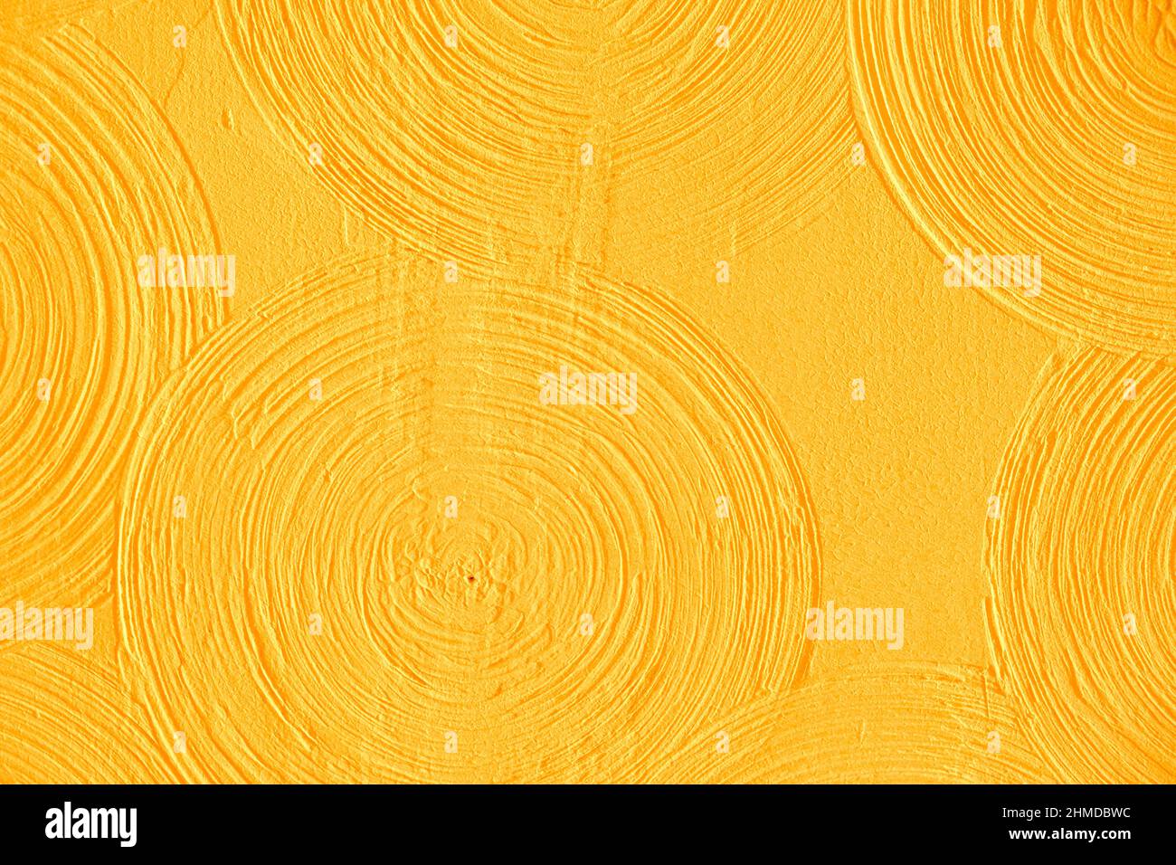 Closeup yellow abstract background gypsum panel, spiral shaped ...