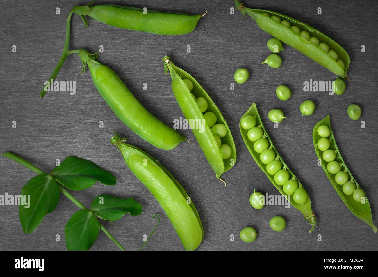 Pods of peas on wooden table. Top view, flat lay Stock Photo - Alamy