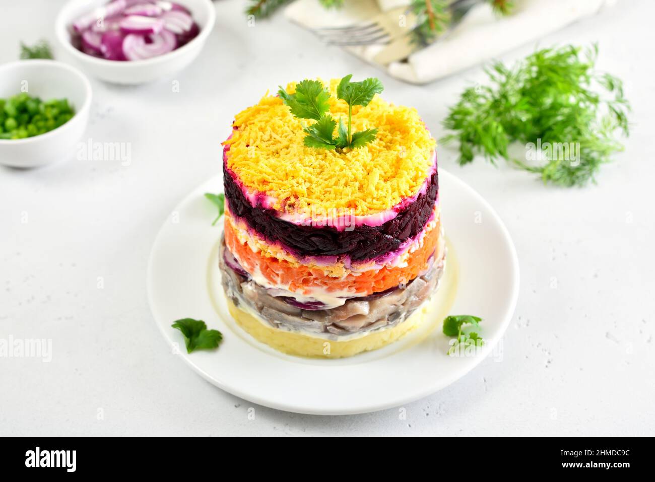 Layered salad with beet, herring, carrots and potatoes. Traditional ...