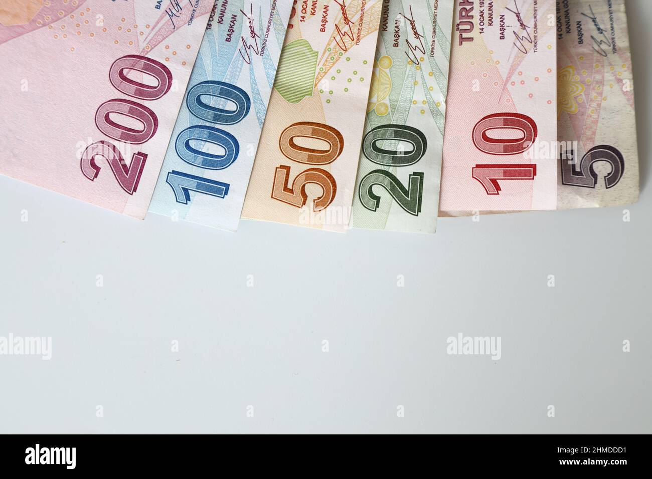 Turksh Lira banknotes of various color, pattern and value on white ...