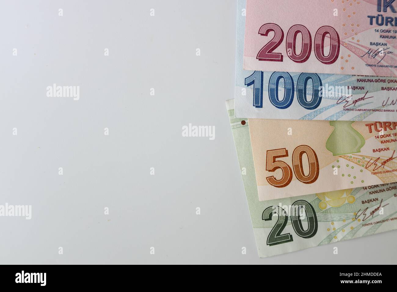 Turksh Lira banknotes of various color, pattern and value on white ...