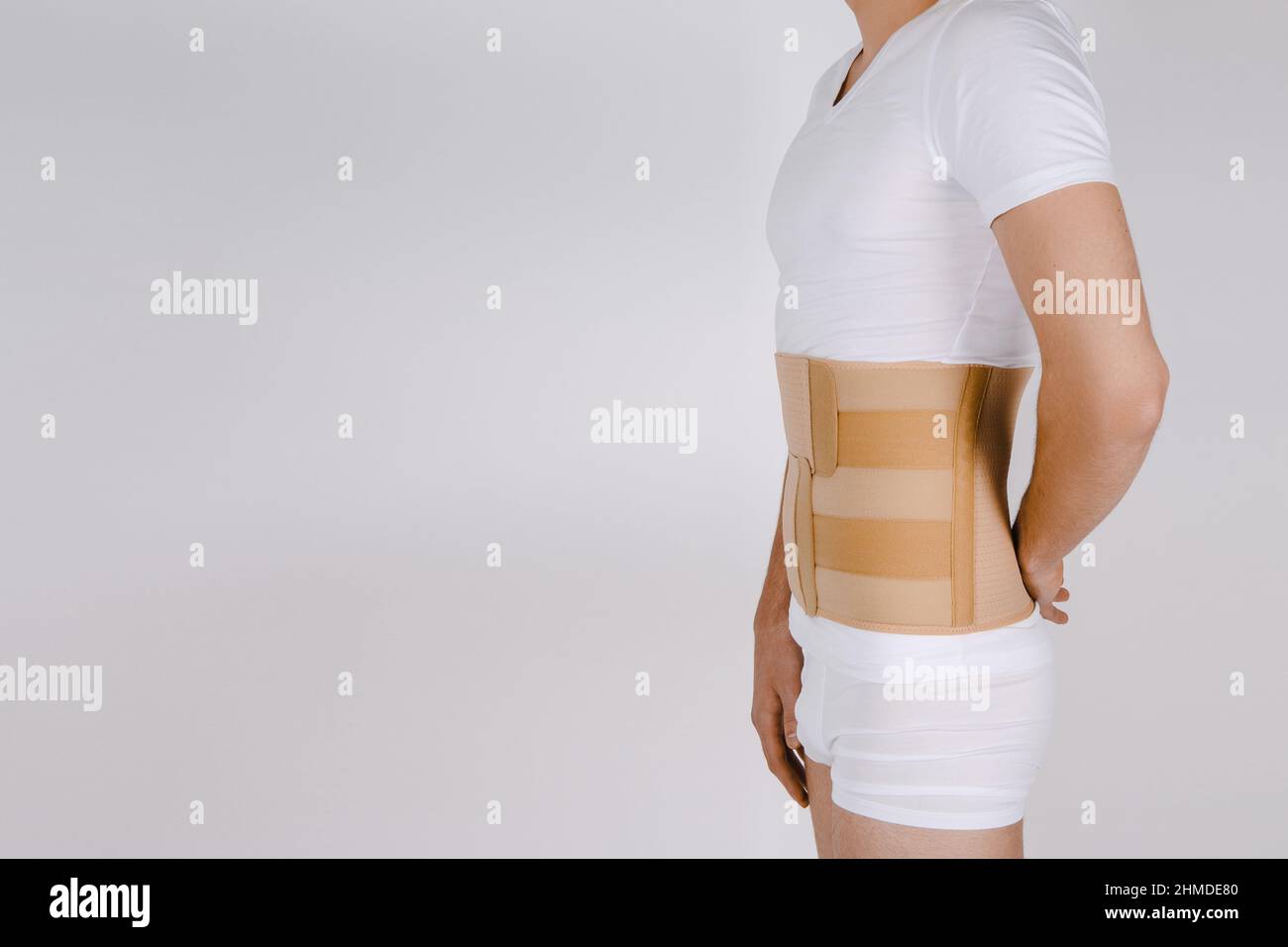 Orthopedic lumbar corset on the human body. Back brace, waist support ...