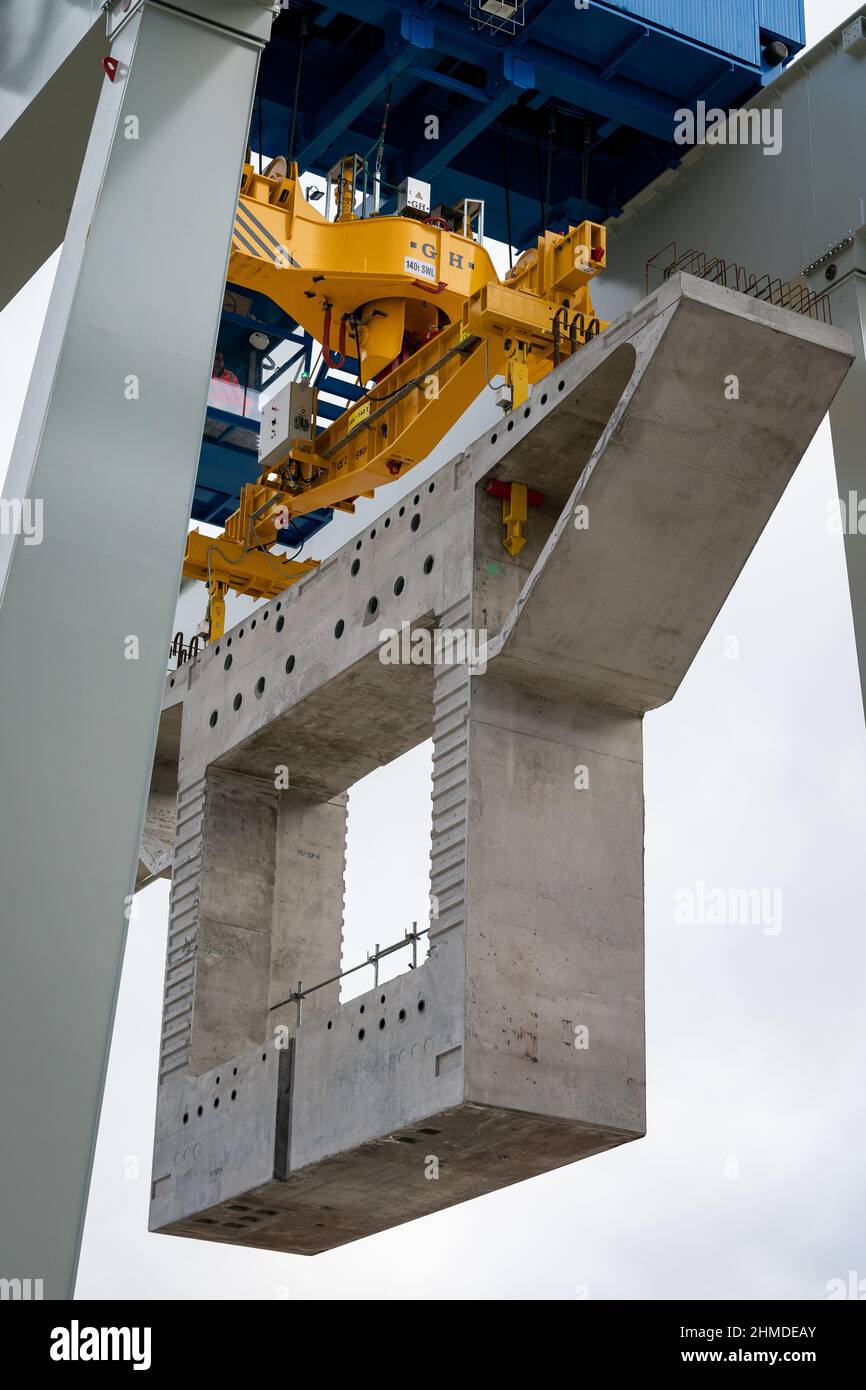 A concrete segment is carried by a crane at the HS2/Align Compound in ...