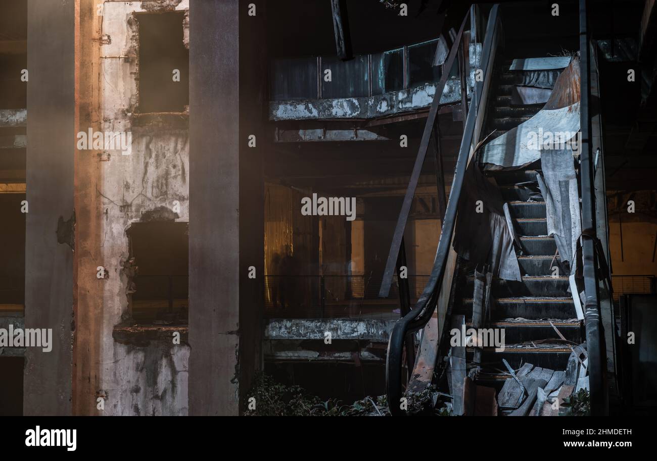 Damaged escalator in abandoned shopping mall building. Structural and ...