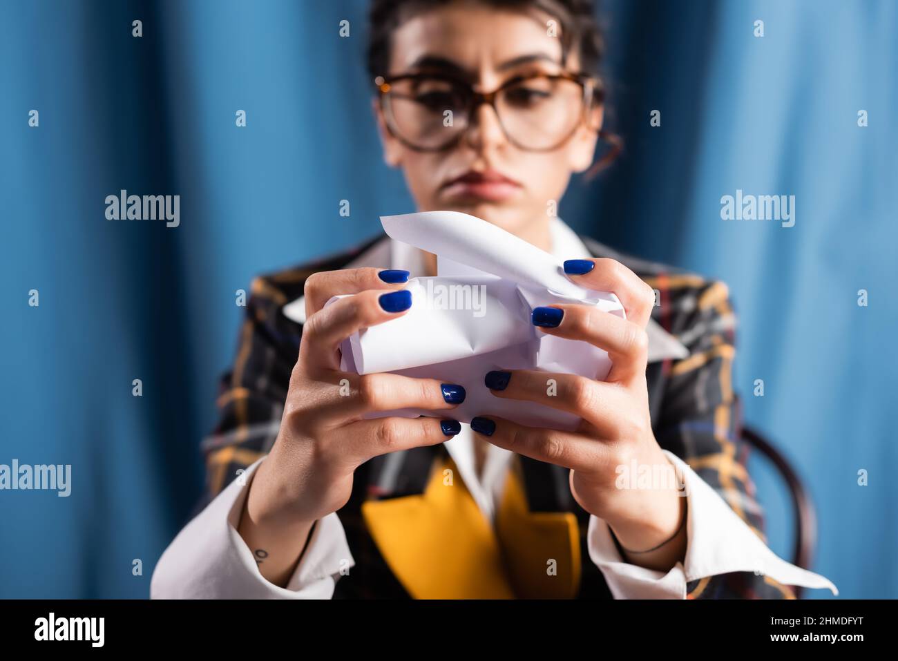 Woman crumpling paper hi-res stock photography and images - Alamy