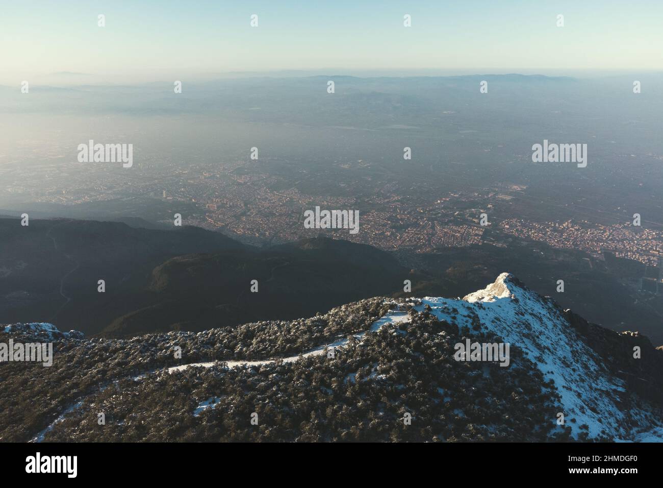 Snowy mountain with Manisa city view on the background at Mount Spil ...