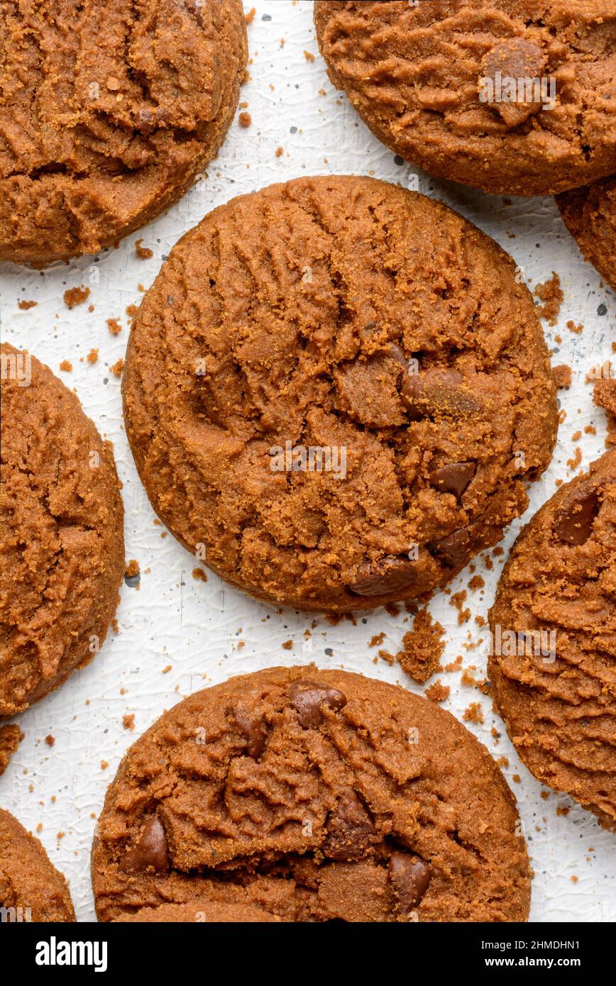 chocolate biscuits on a white surface, closeup view of round shape ...