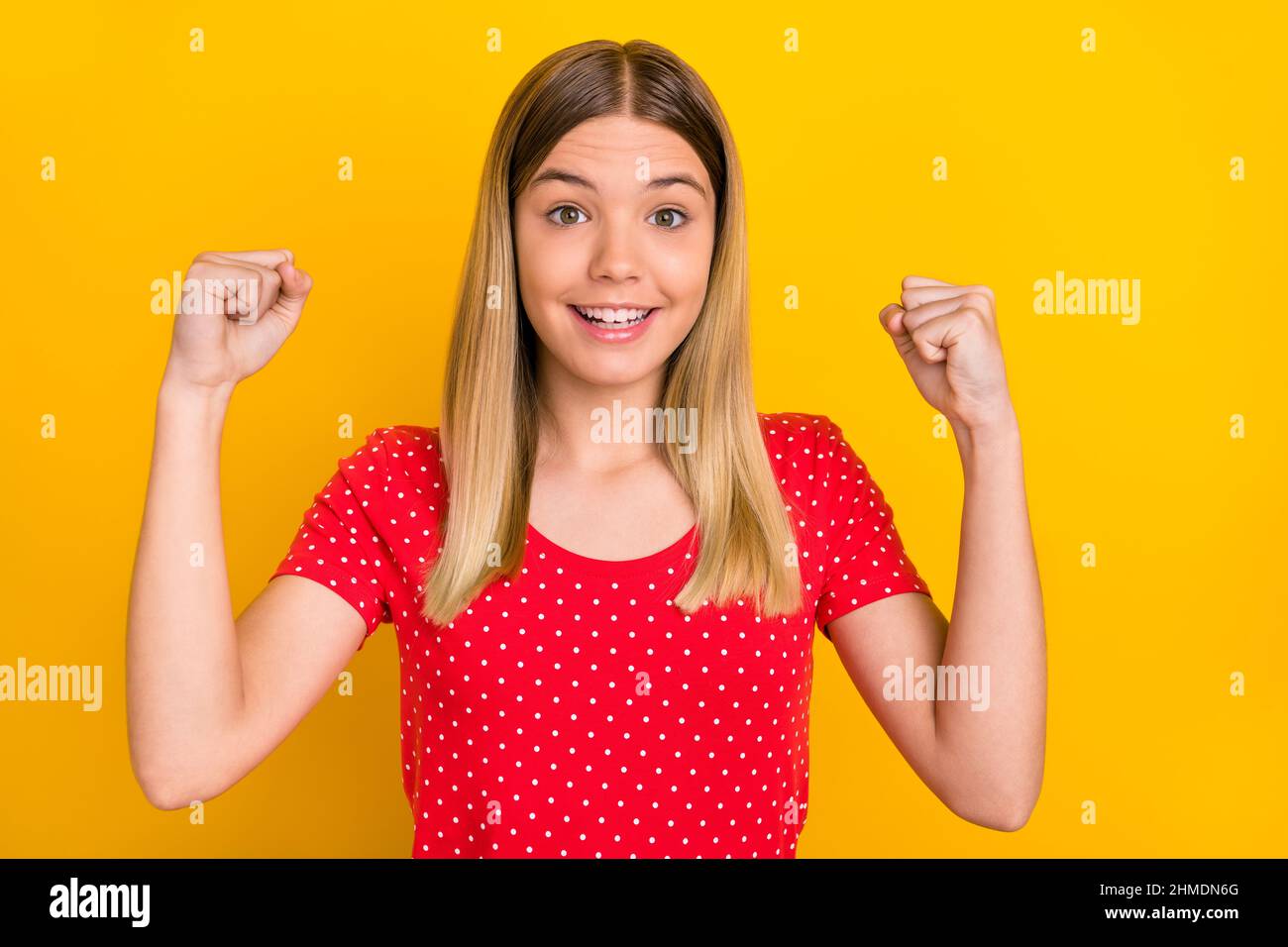 Photo of delighted positive girl raise fists celebrate luck toothy ...