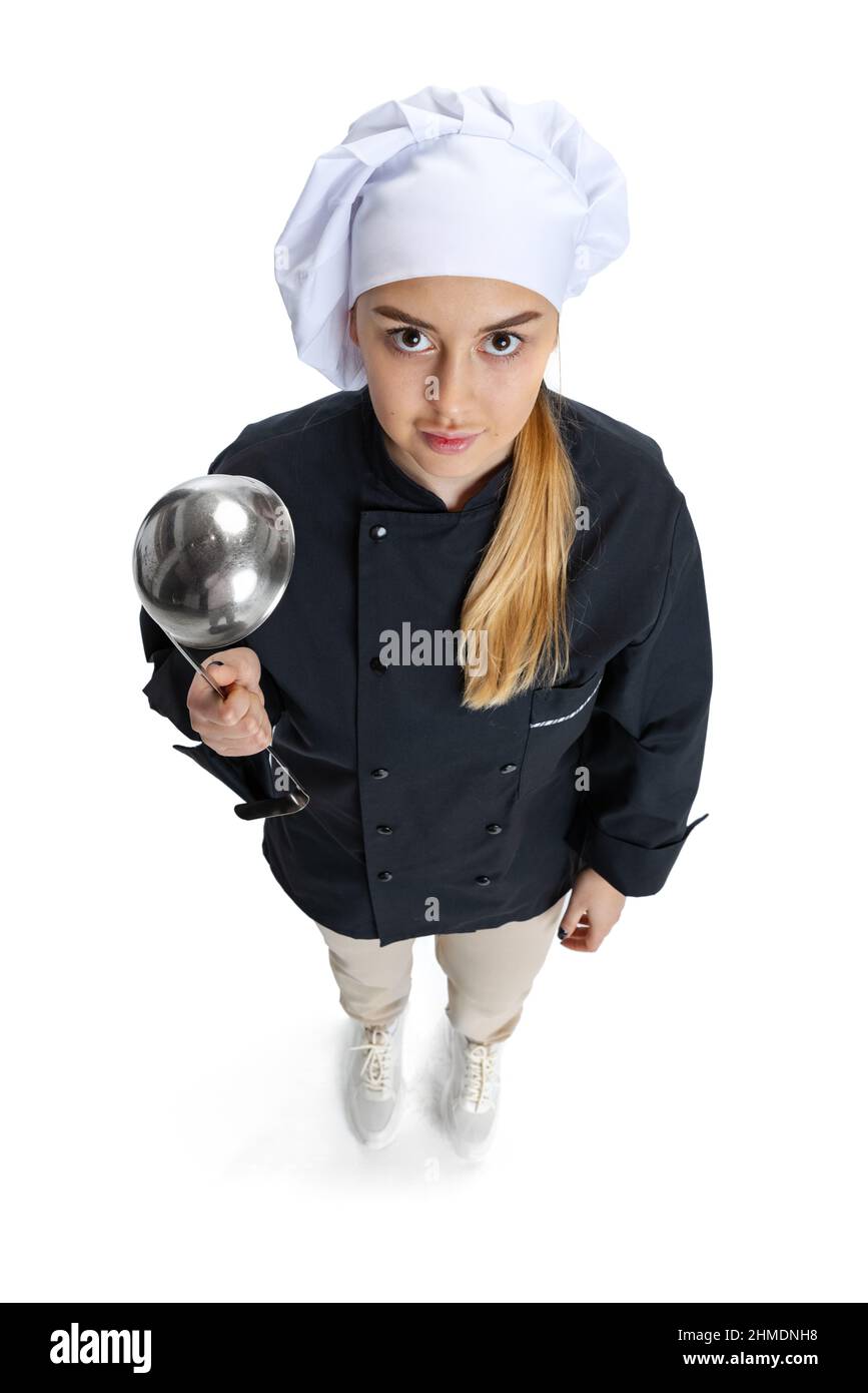 High angle view of beautiful young woman, lady-cook, chef in black ...