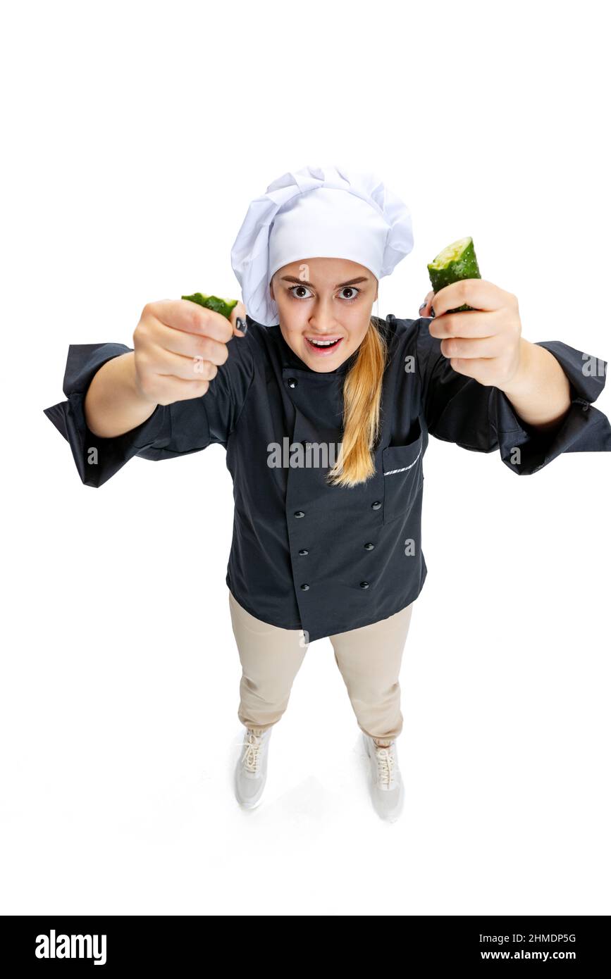High angle view of beautiful young woman, lady-cook, chef in black ...