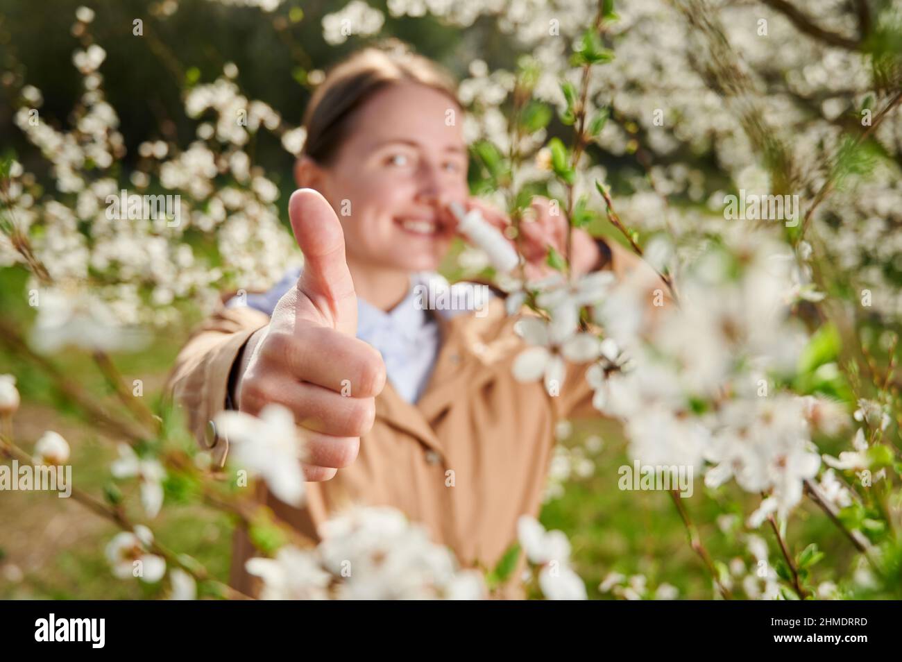 Woman allergic suffering from seasonal allergy at spring, posing in ...