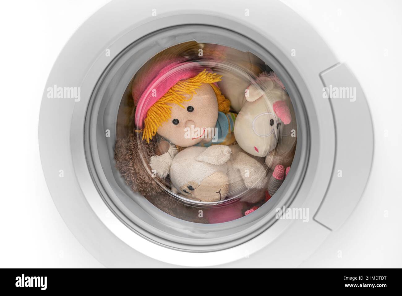 Children's toys in the washing machine Stock Photo - Alamy