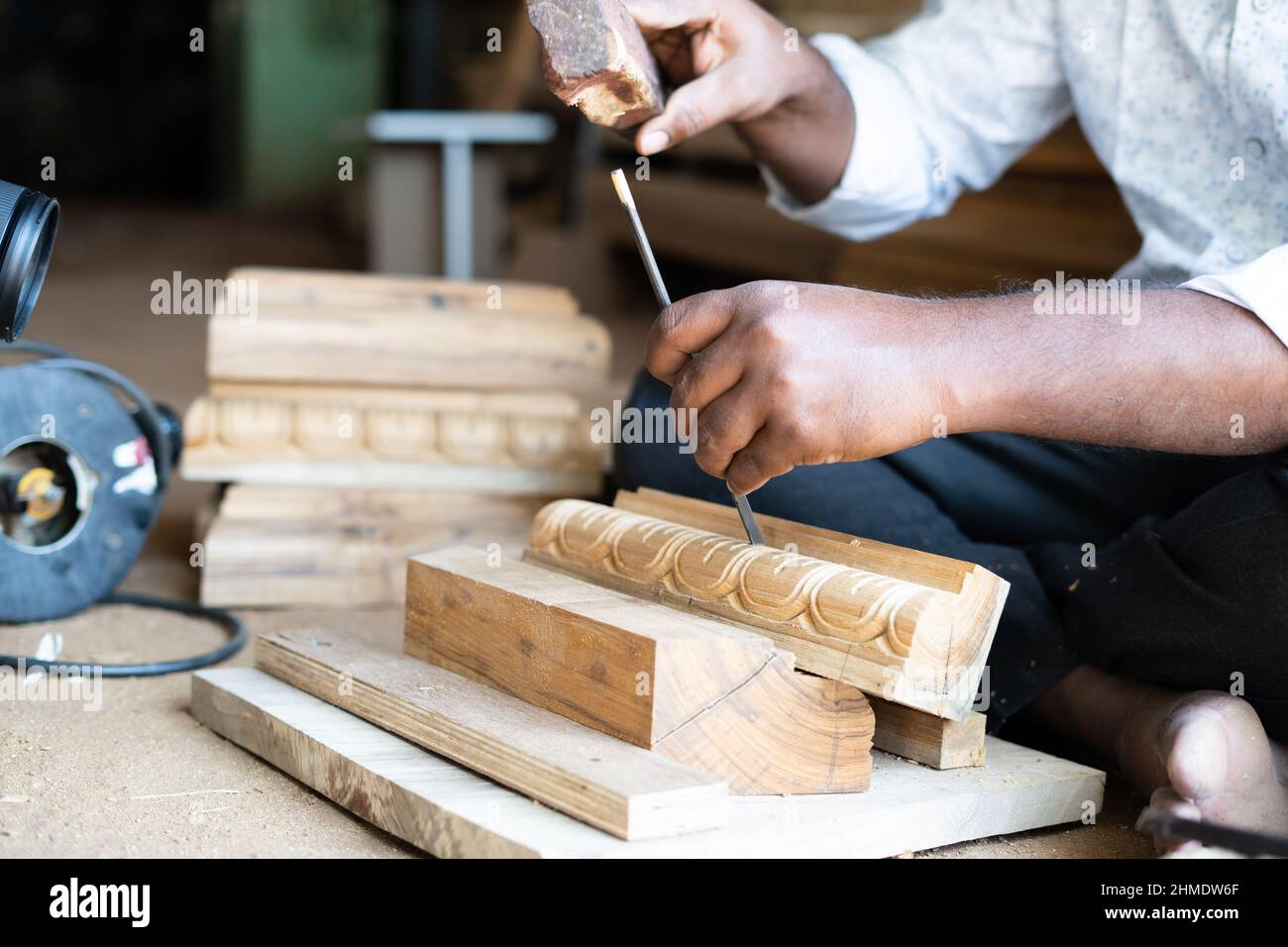 close up shot of carpenter making wood design by using carpentry tools ...