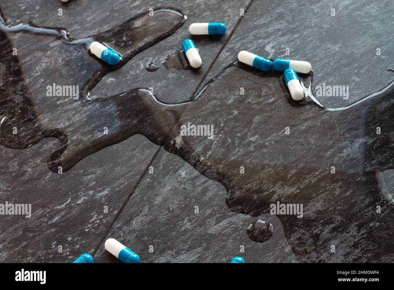 Tablets. Water is spilled and medical capsules are scattered. Ambulance ...