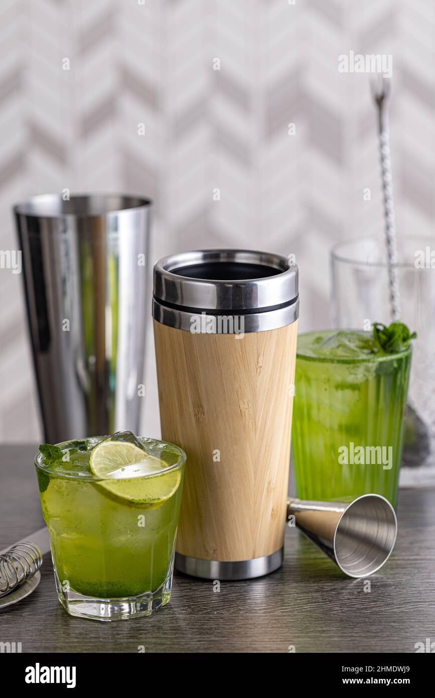 Green cocktail with vermouth, mint and citrus. Summer drink concept ...
