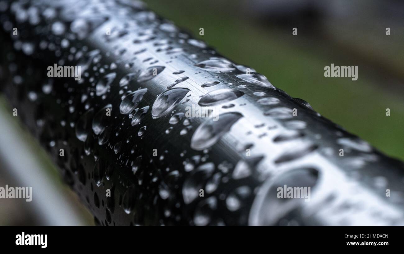 Water droplets on a wet metal rail after some heavy rain Stock Photo ...