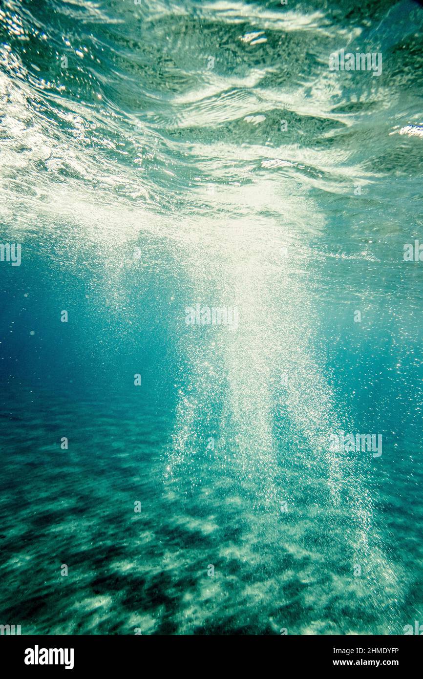 Underwater bubbles with sunlight in deep sea Stock Photo - Alamy
