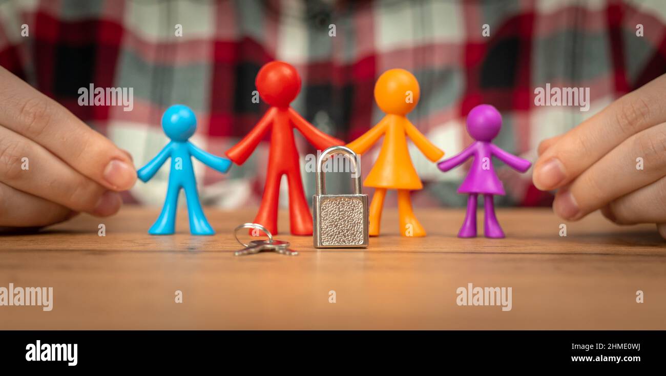 Family problems, plastic colorful figurines on wooden table with ...