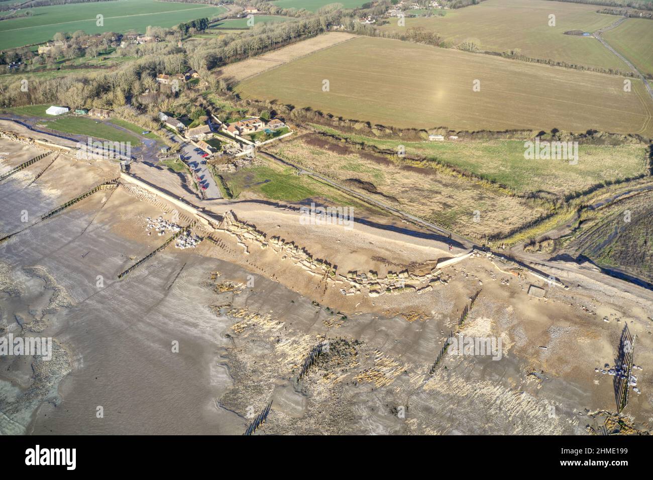Climping Beach in West Sussex and broken wooden groynes at low tide ...