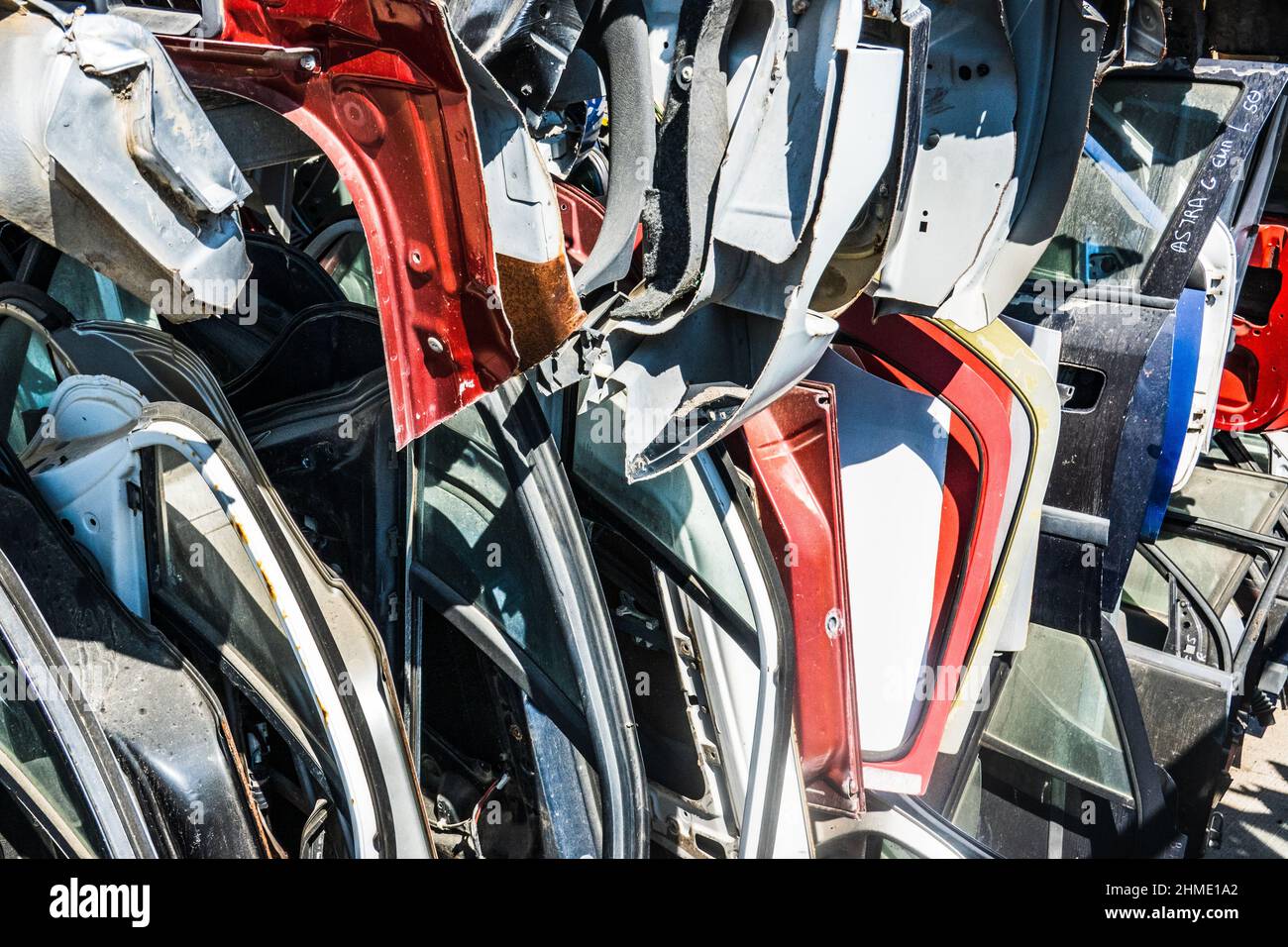 Stacks of old damaged car doors at junkyard Stock Photo - Alamy