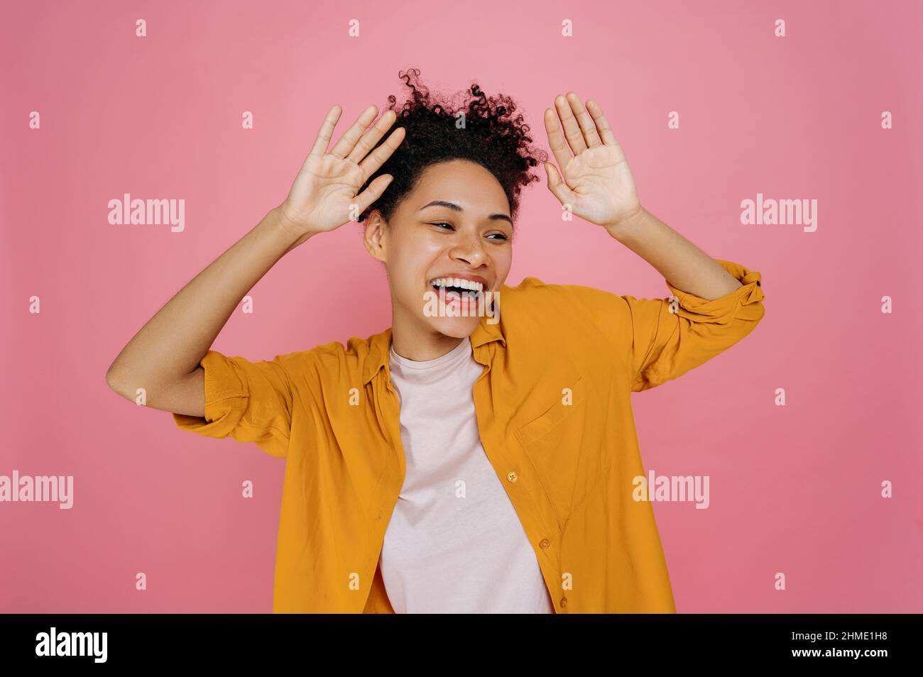 Victory, celebration, joy. Happy lovely millennial african american ...