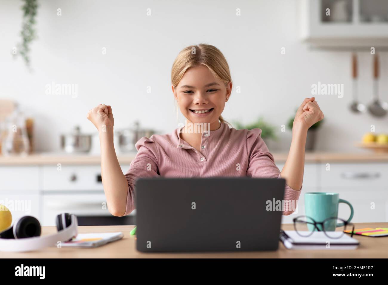 Happy excited european youngsters blonde girl pupil celebrating victory ...