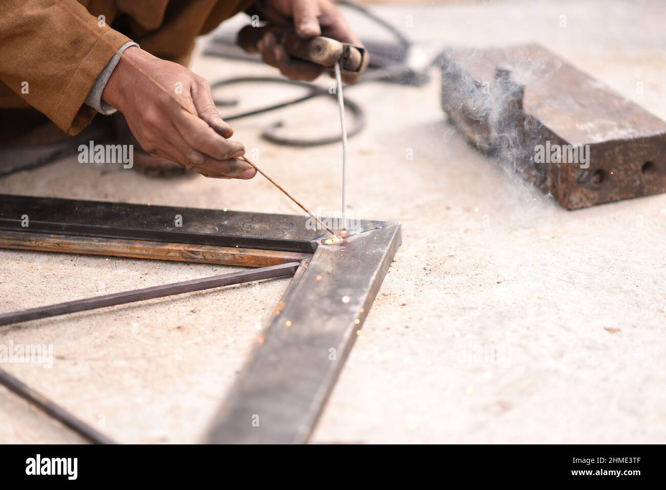 Steel welding, Welder works . Welding of the metal frame of the fence ...