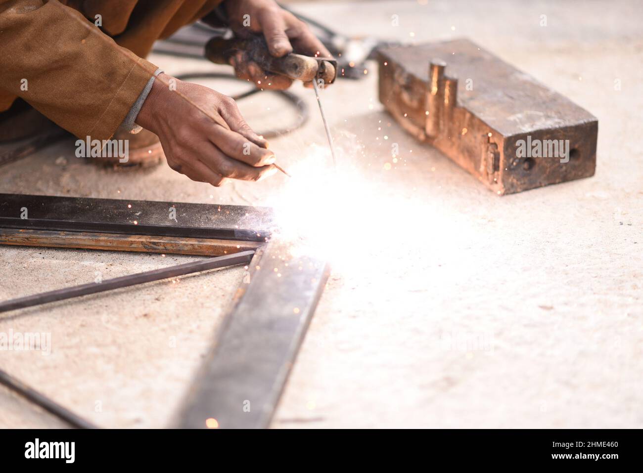 Steel welding, Welder works . Welding of the metal frame of the fence ...