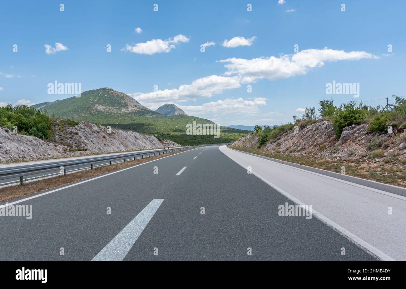 Scenic road. Road is surrounded by a magnificent natural landscape ...