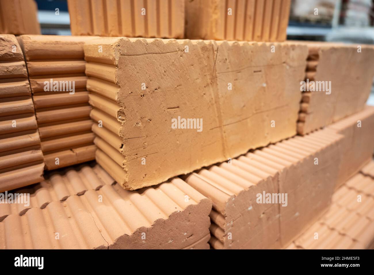 Red bricks stocked in store. Buildings construction material Stock ...
