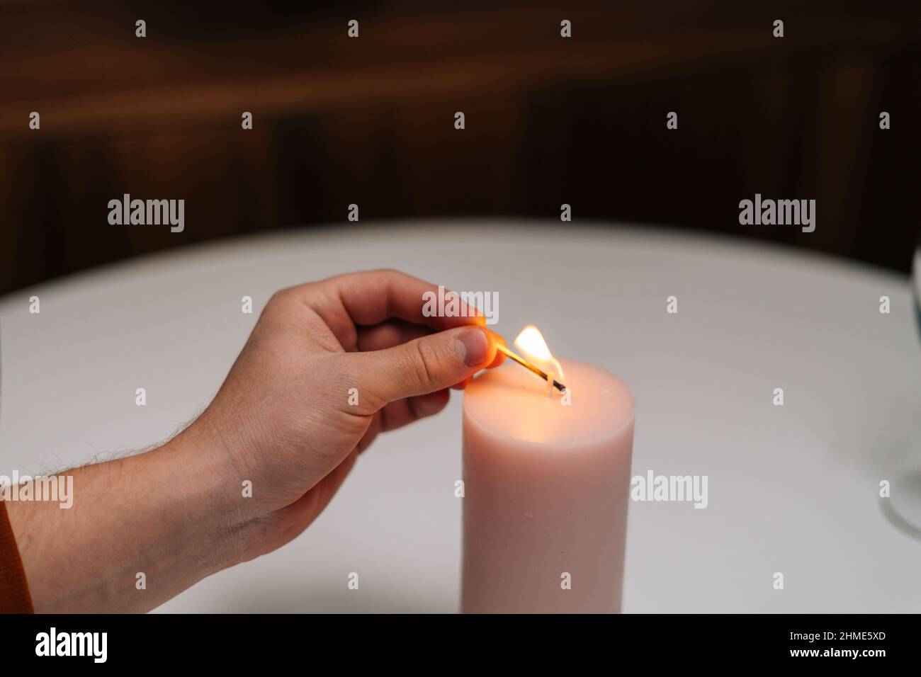 Person lighting candle matchstick in hi-res stock photography and ...