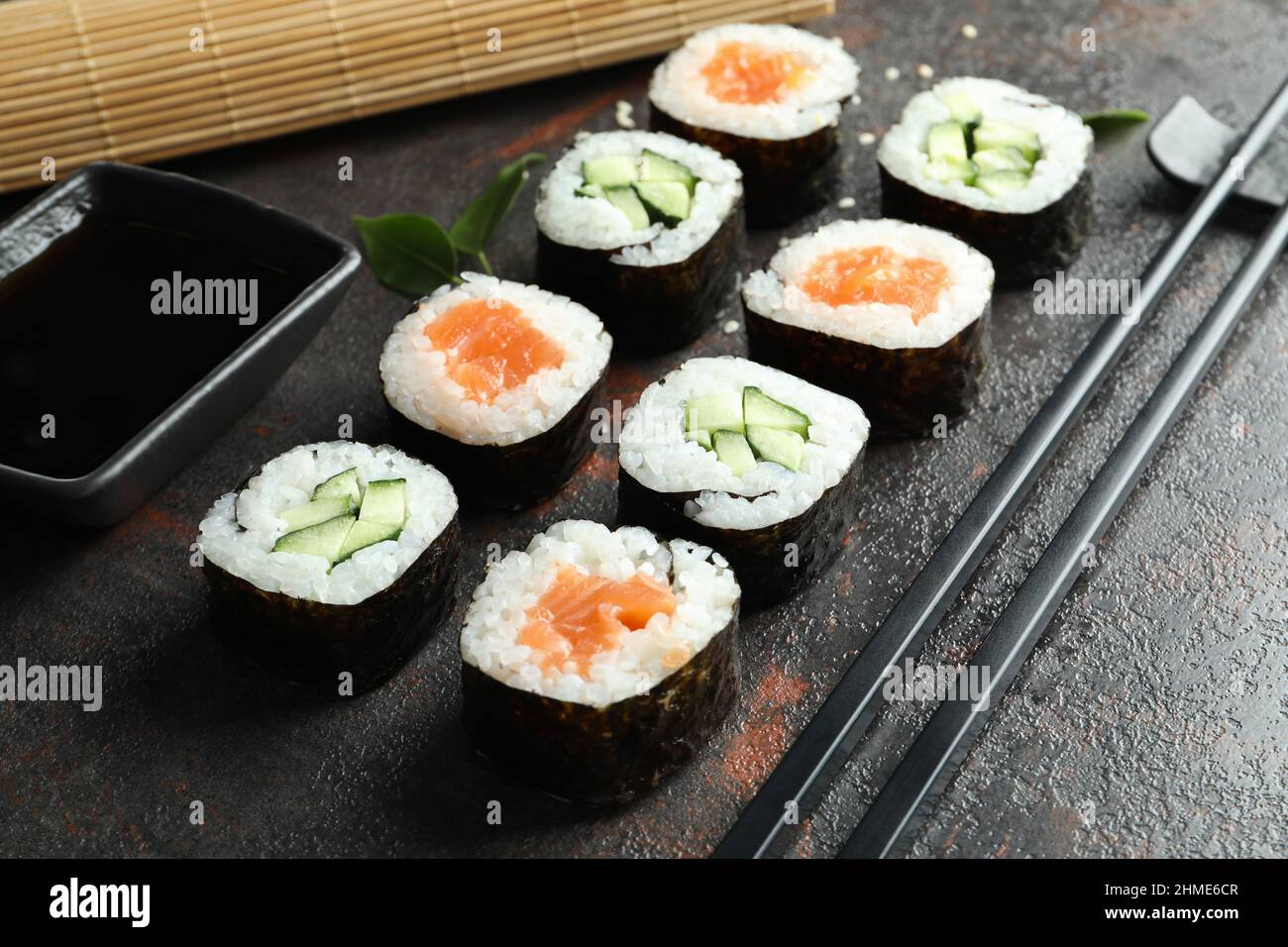 Concept of tasty food with maki on dark textured background Stock Photo ...