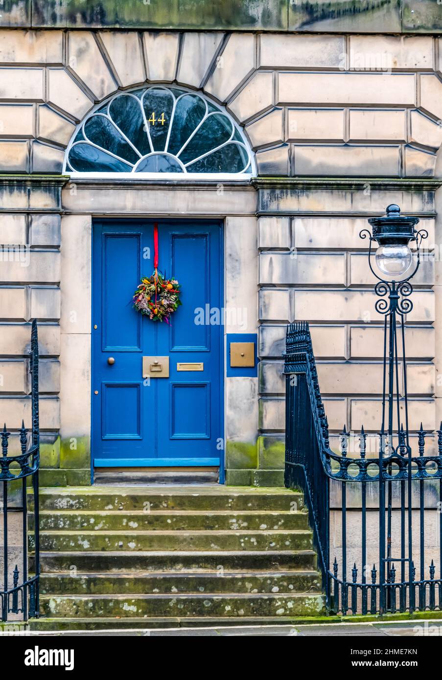 Georgian townhouse panelled front door with Christmas wreath, fanlight ...